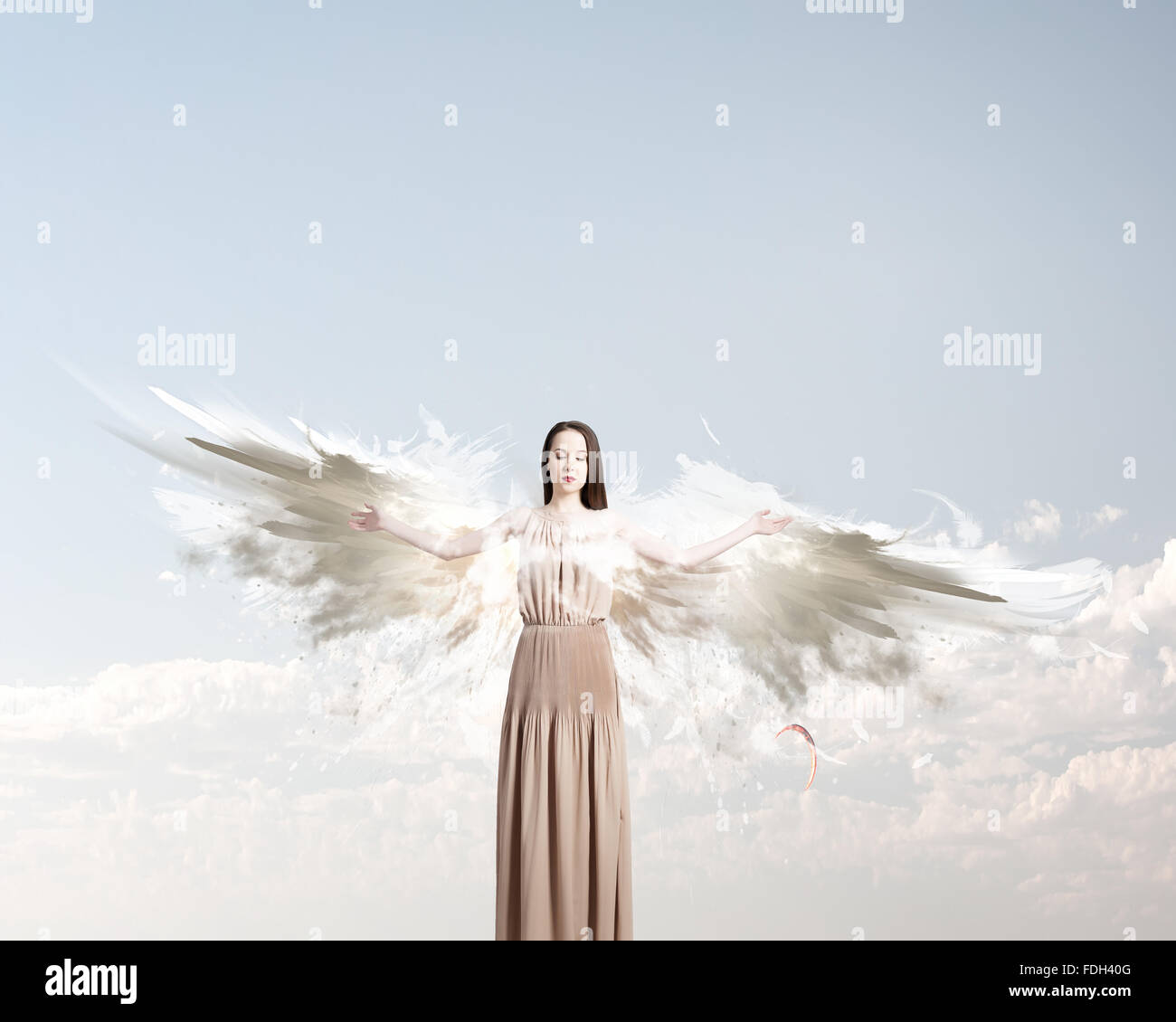Attractive woman with angel wings on sky background Stock Photo - Alamy