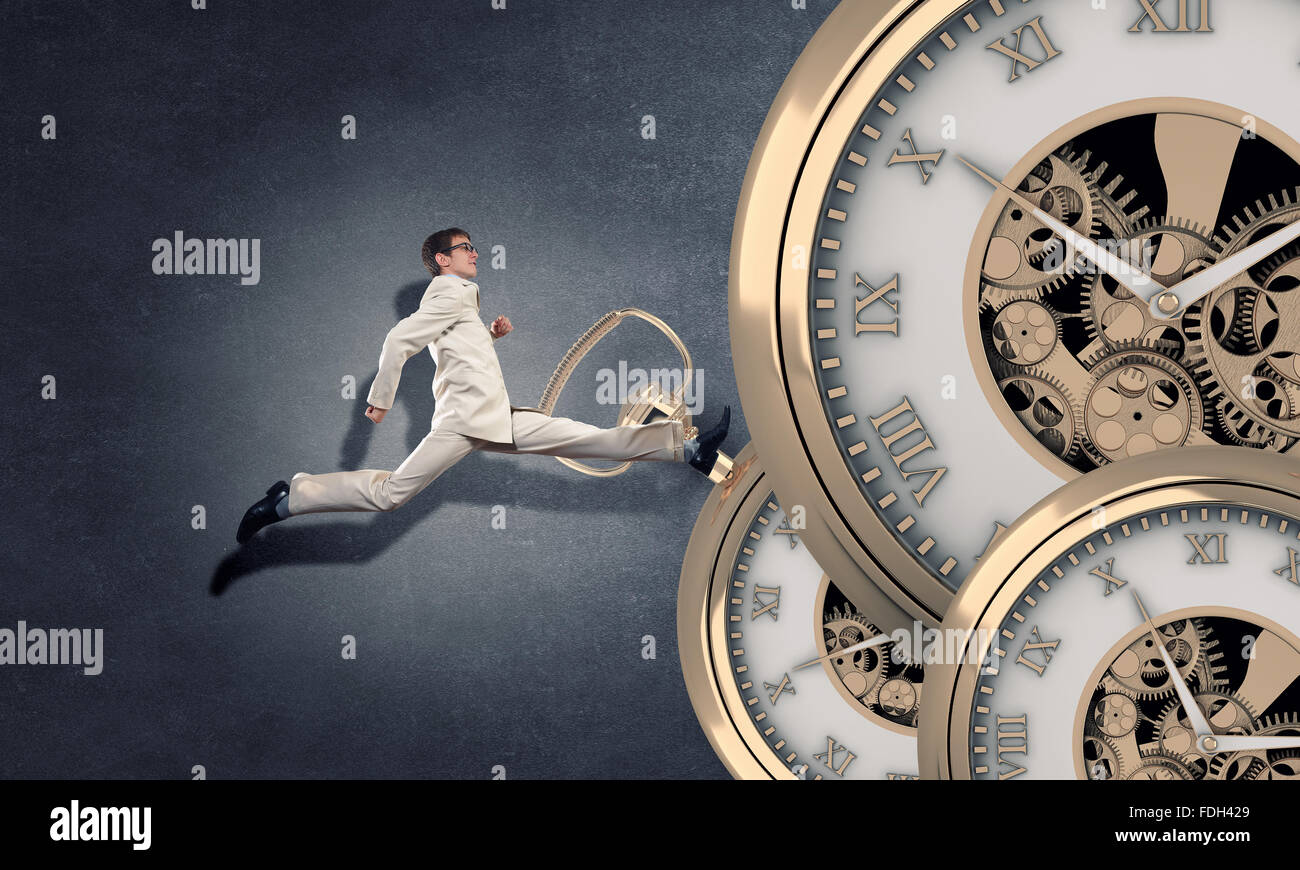 Concept of time with funny businessman running in a hurry Stock Photo ...
