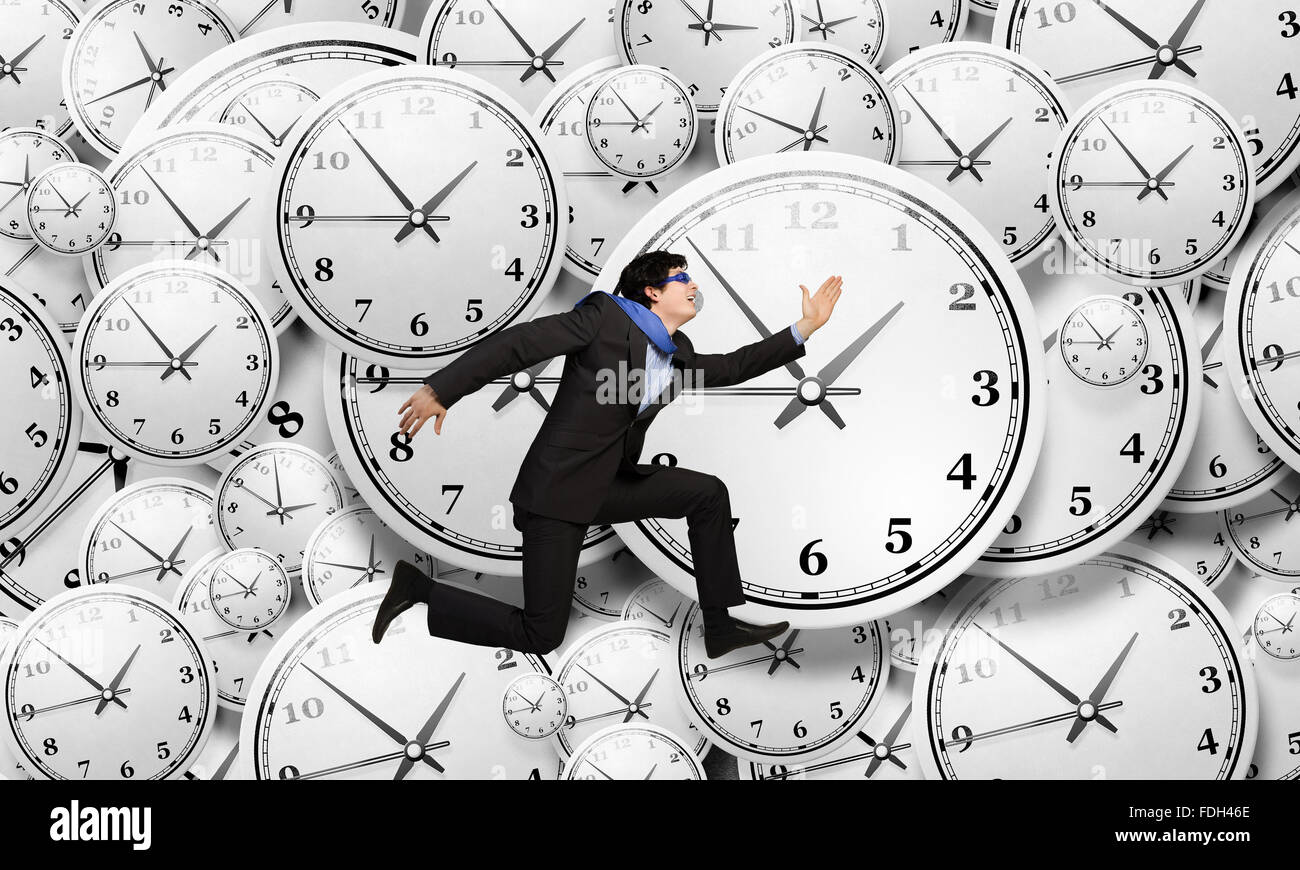 Concept of time with funny businessman running in a hurry Stock Photo ...