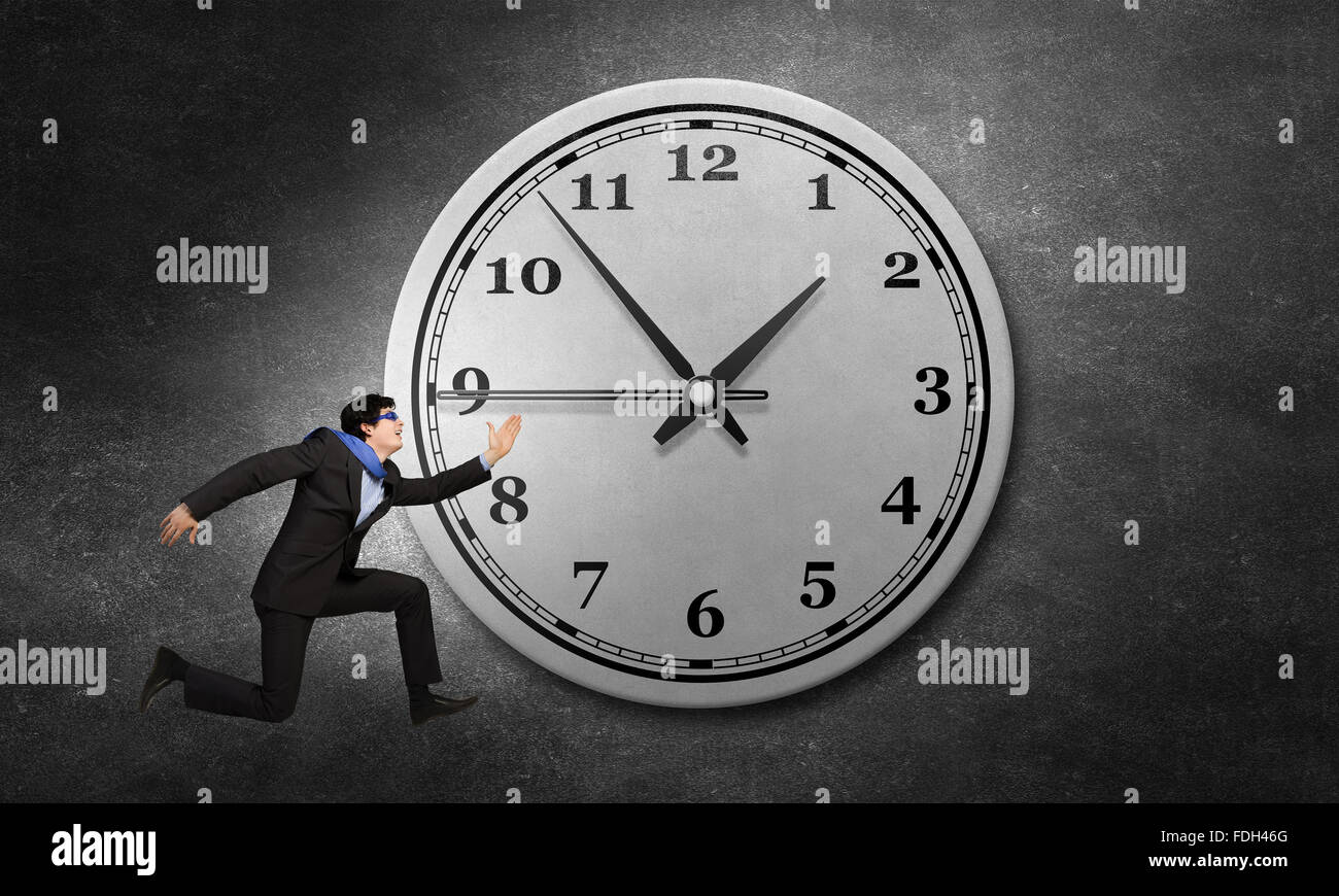 Concept of time with funny businessman running in a hurry Stock Photo ...