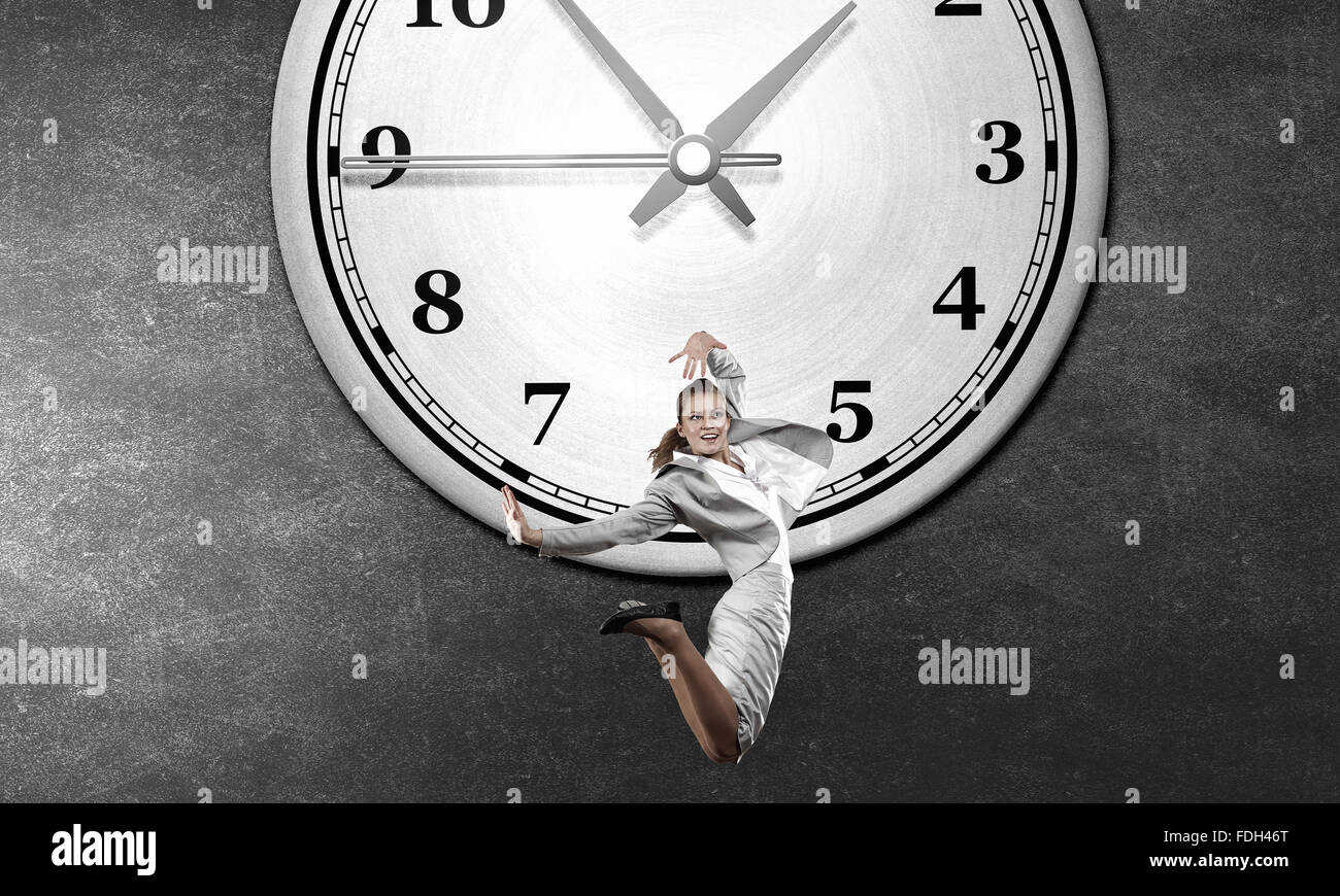 Concept of time with funny businesswoman running in a hurry Stock Photo ...