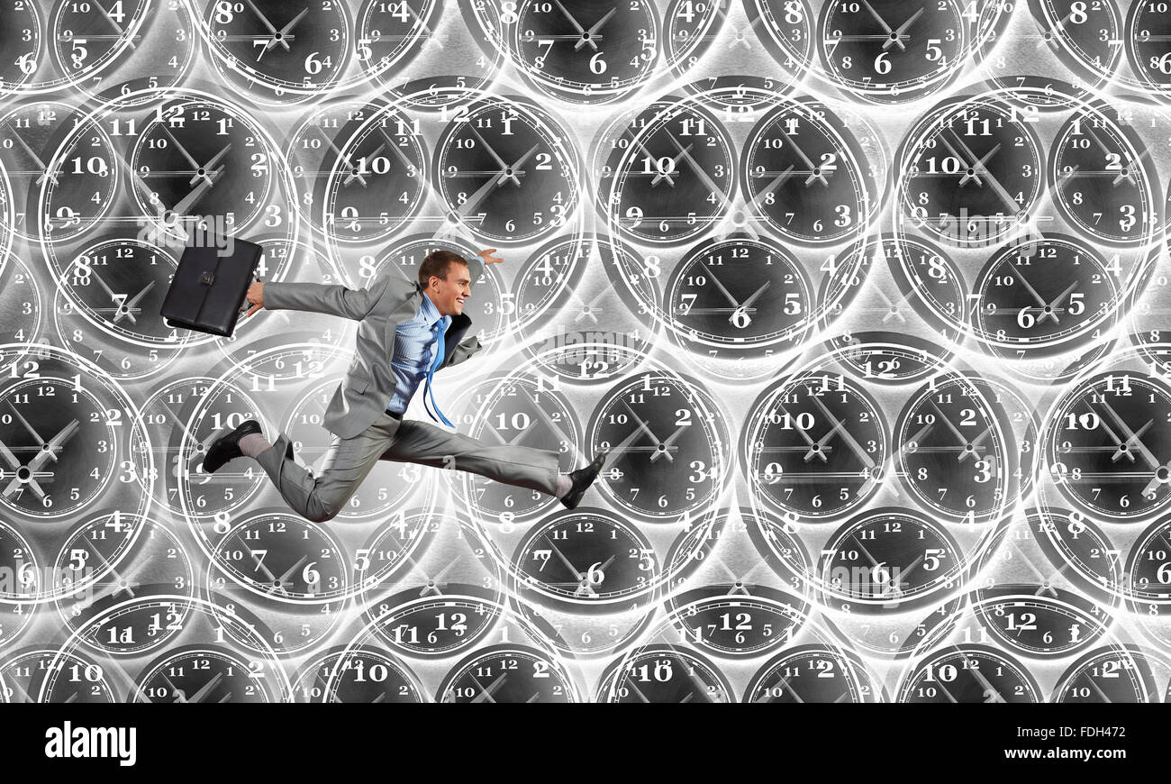 Concept of time with funny businessman running in a hurry Stock Photo ...