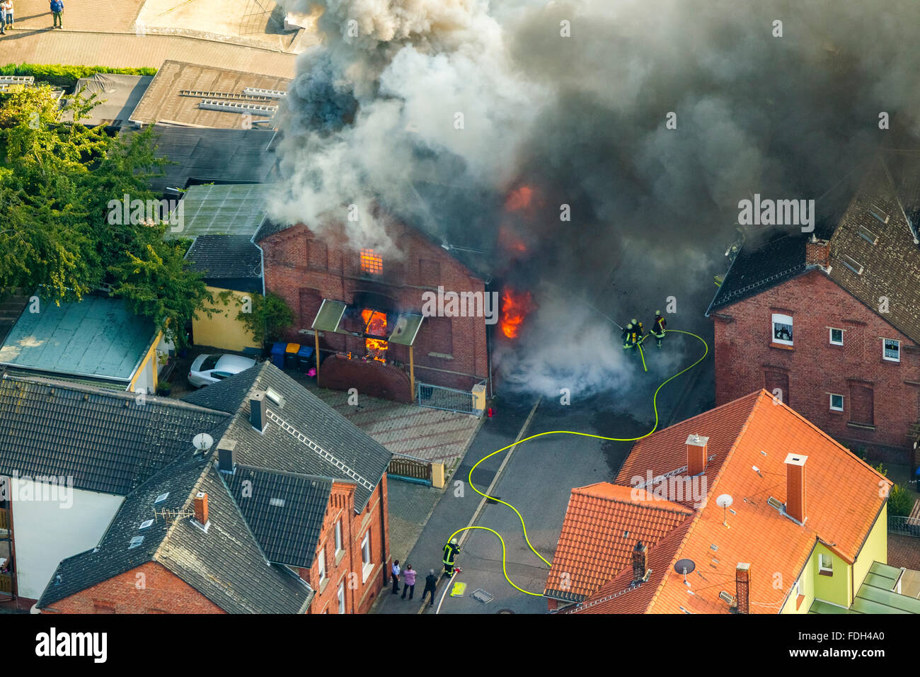 Aerial view, house fire, fire brigade, fire in a coal mine house fire ...