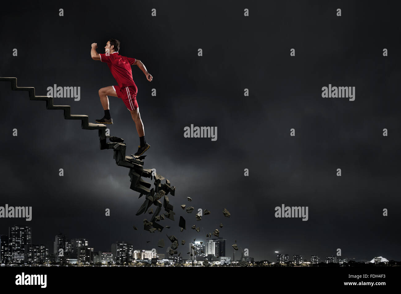 Sports active man running on stone collapsing ladder Stock Photo - Alamy