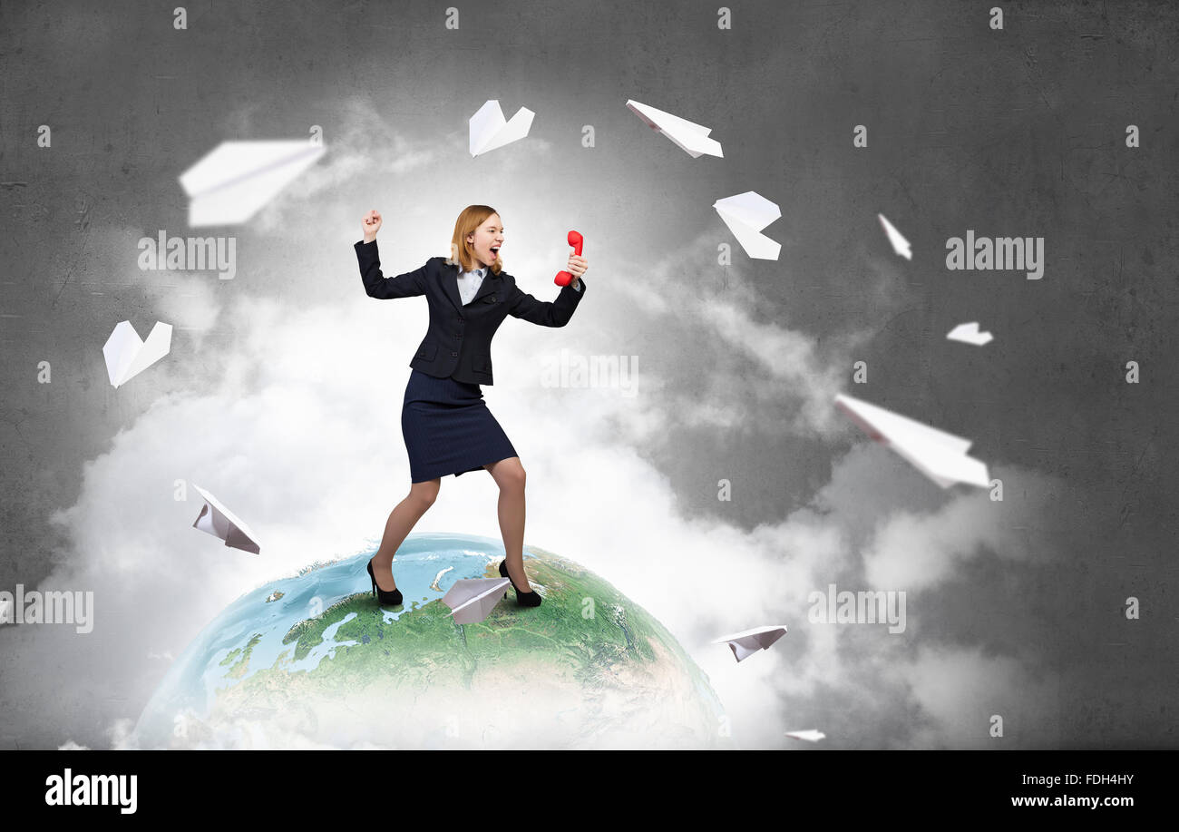 Young businesswoman with red phone receiver in hands. Elements of this ...