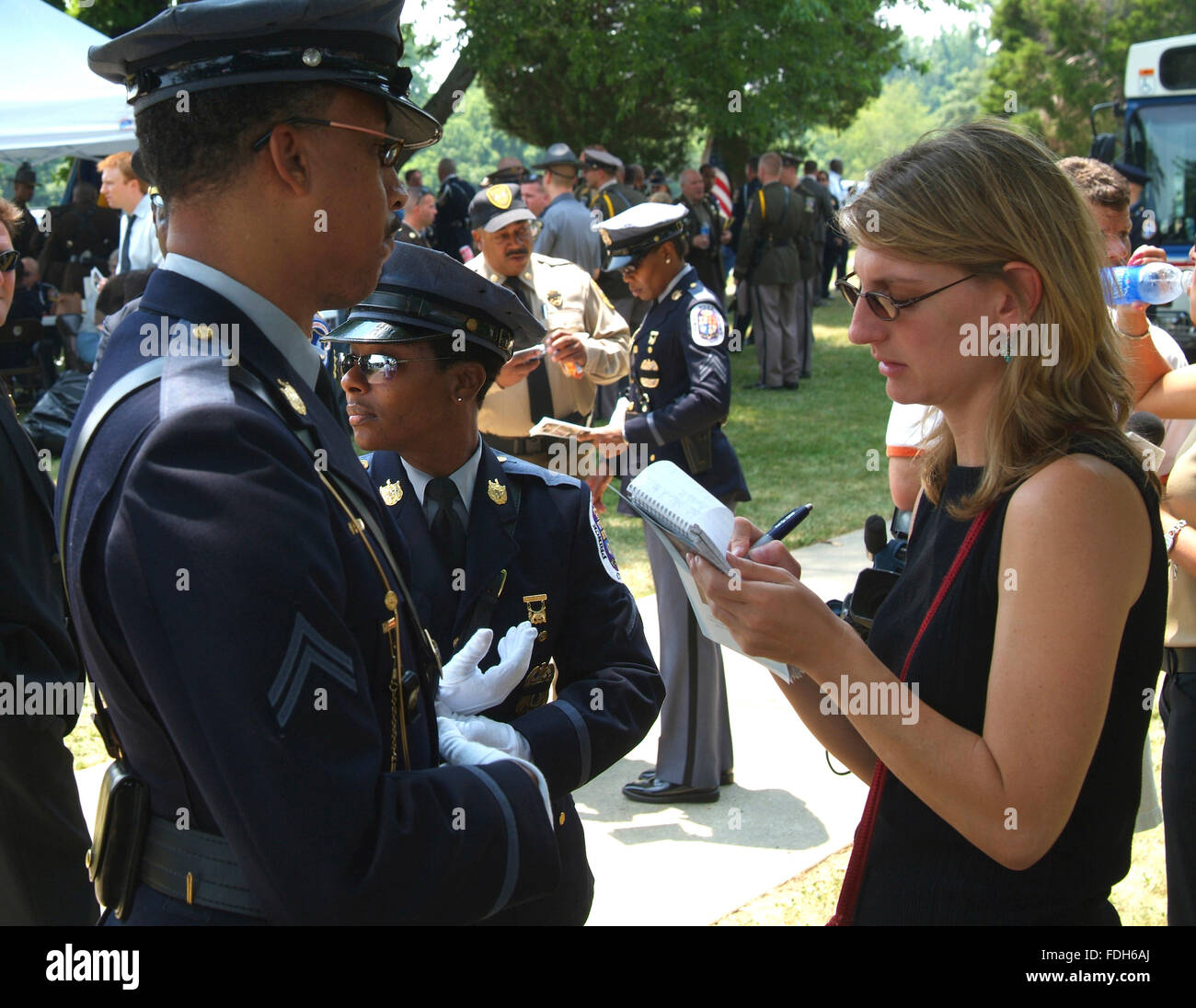 Reporter interview police hi-res stock photography and images - Alamy