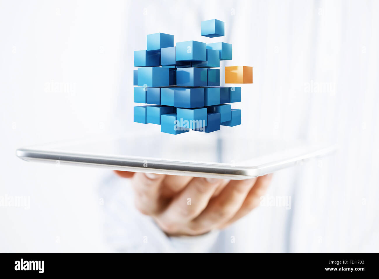 Businessman holding tablet and cube as symbol of problem solving Stock ...