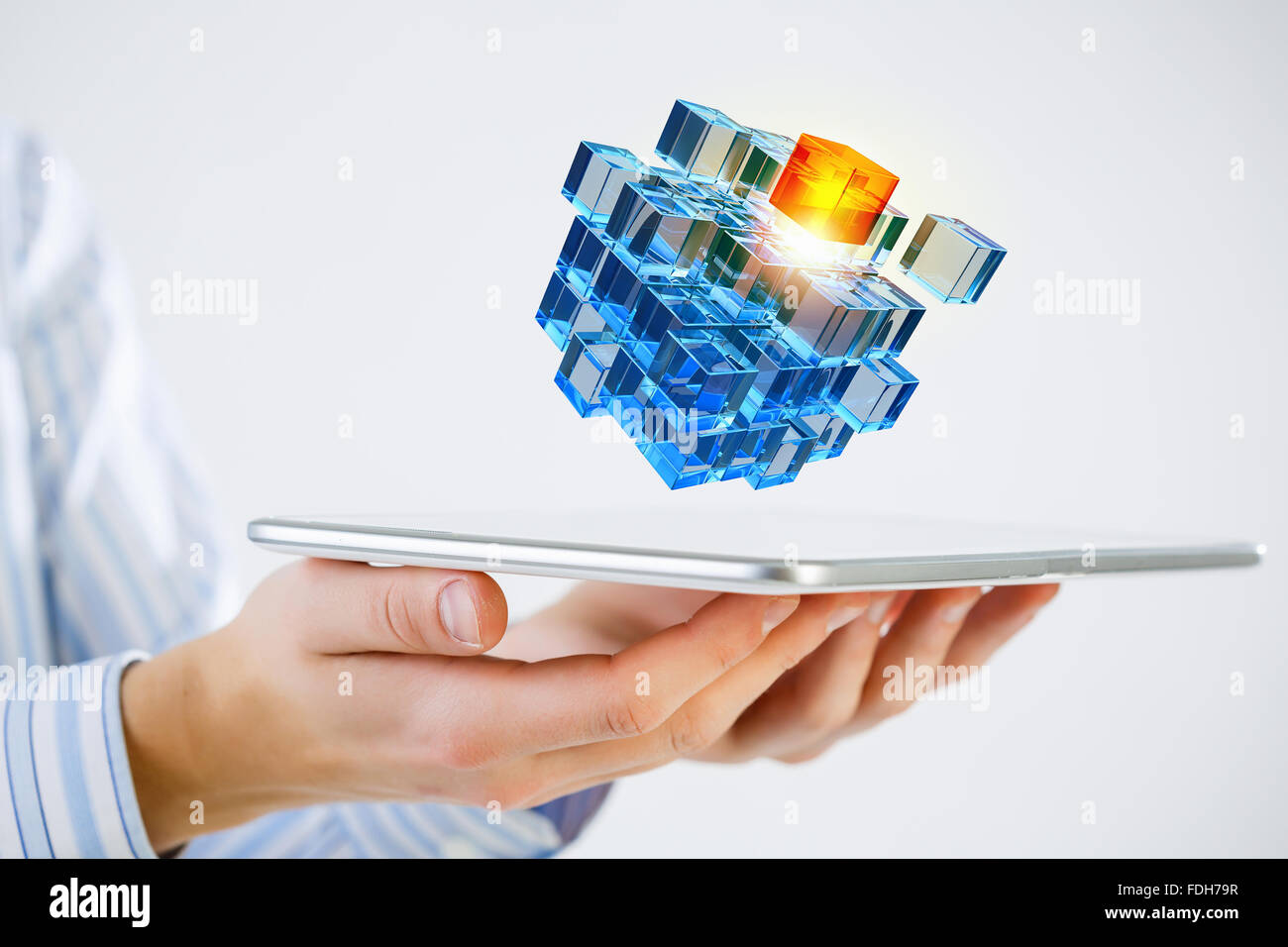 Businessman holding tablet and cube as symbol of problem solving Stock ...