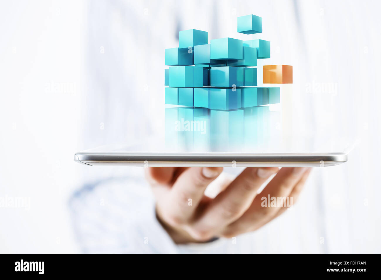 Businessman holding tablet and cube as symbol of problem solving Stock ...