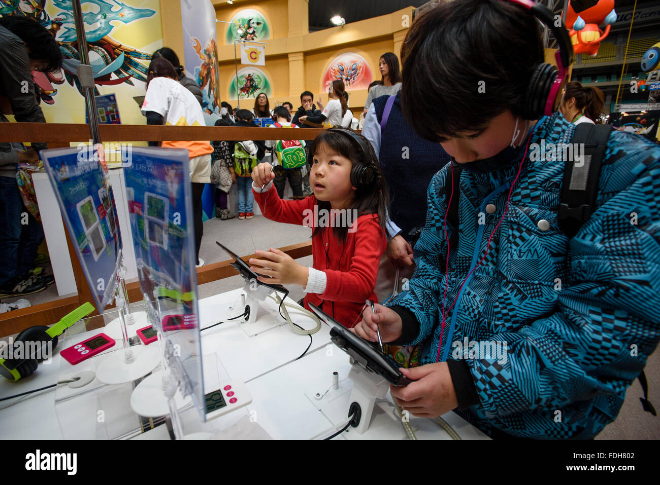 JANUARY 31, 2016 - Children play mobile games at the Next Generation ...