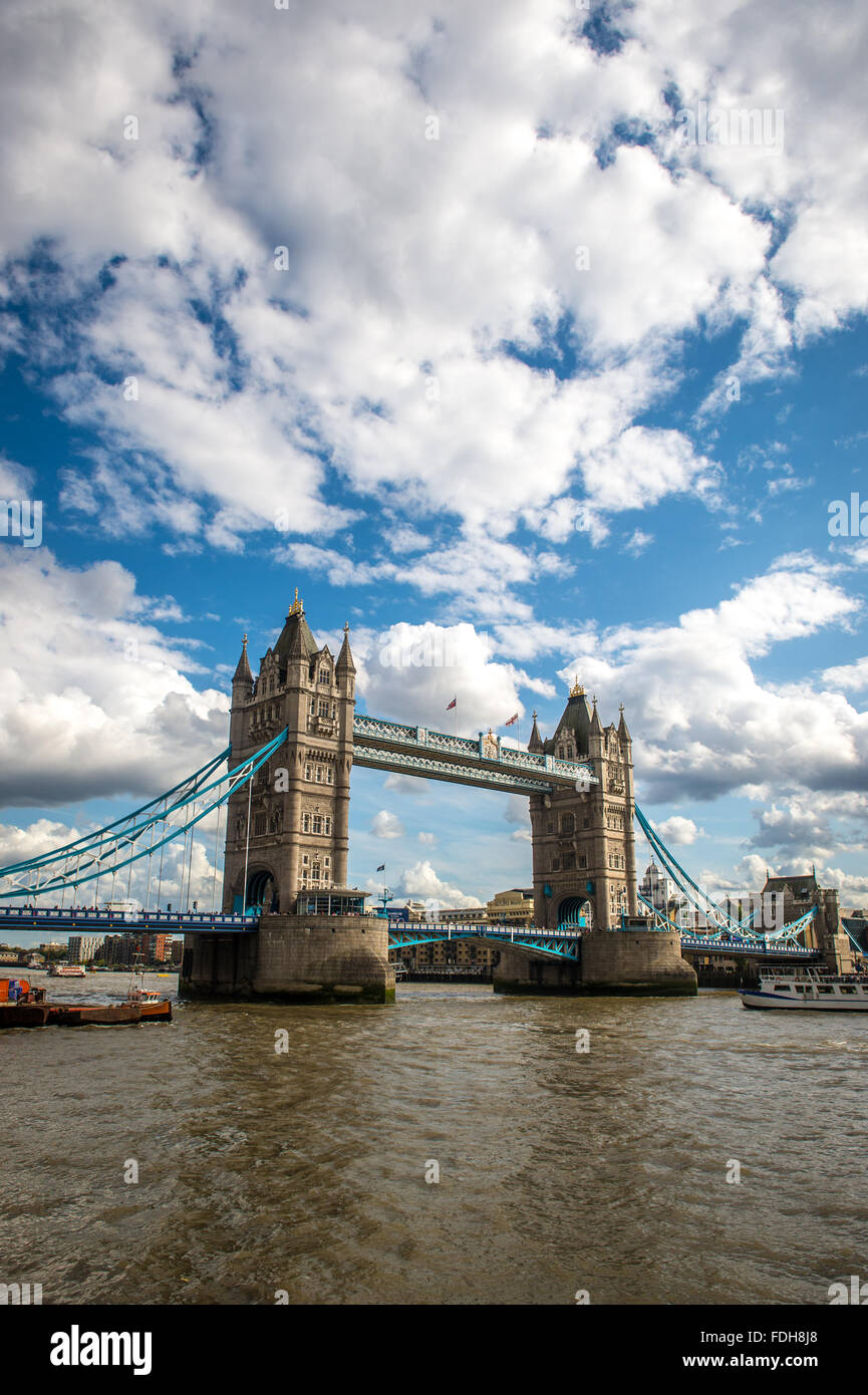 Boats passing by the Tower Bridge on the River Thames in London ...