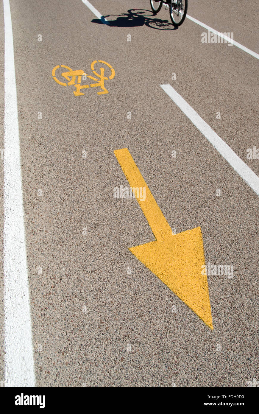 Partial view of man riding bicycle in bicycle lane Stock Photo - Alamy