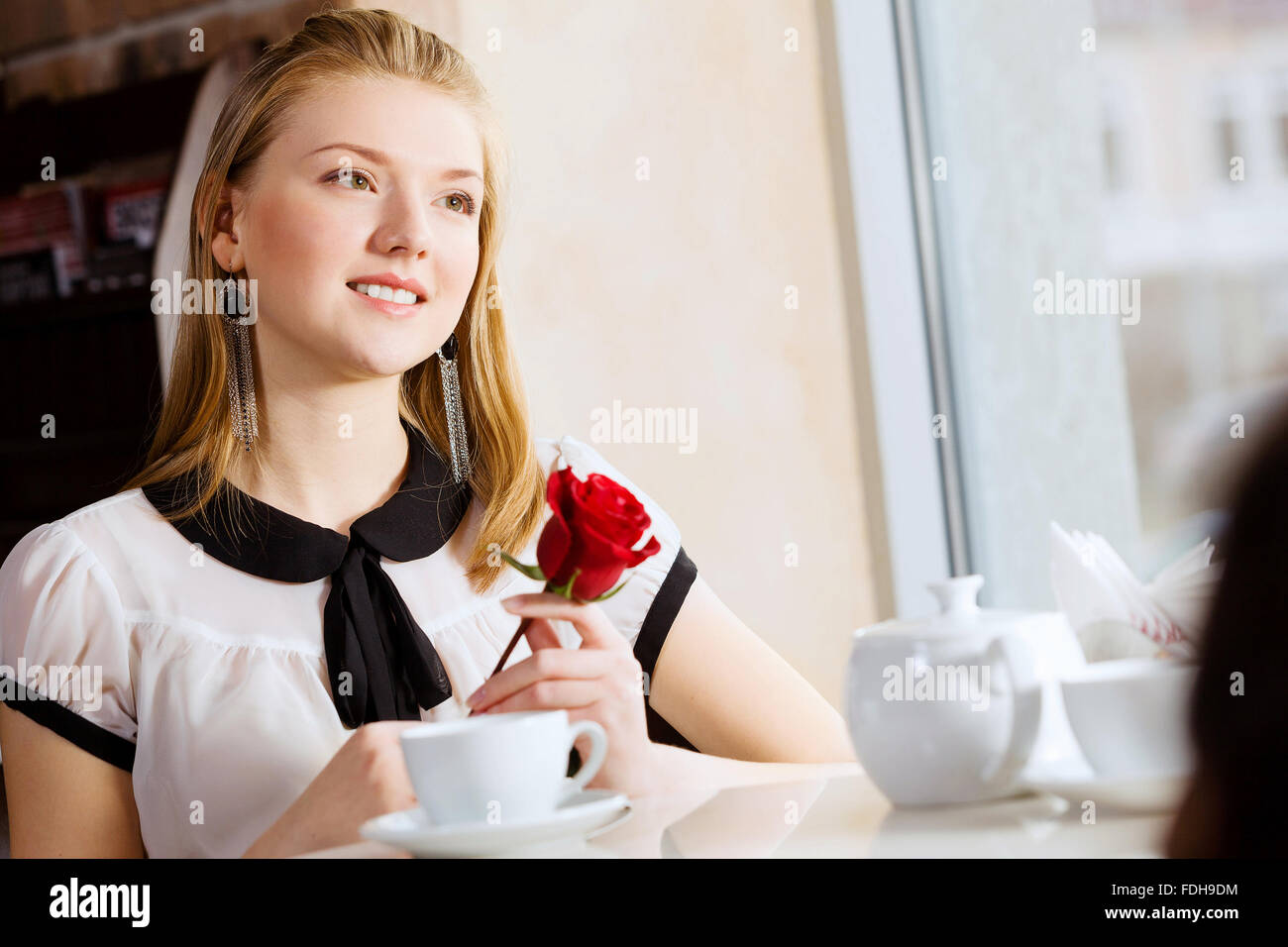 Young attractive lady having date at cafe Stock Photo - Alamy