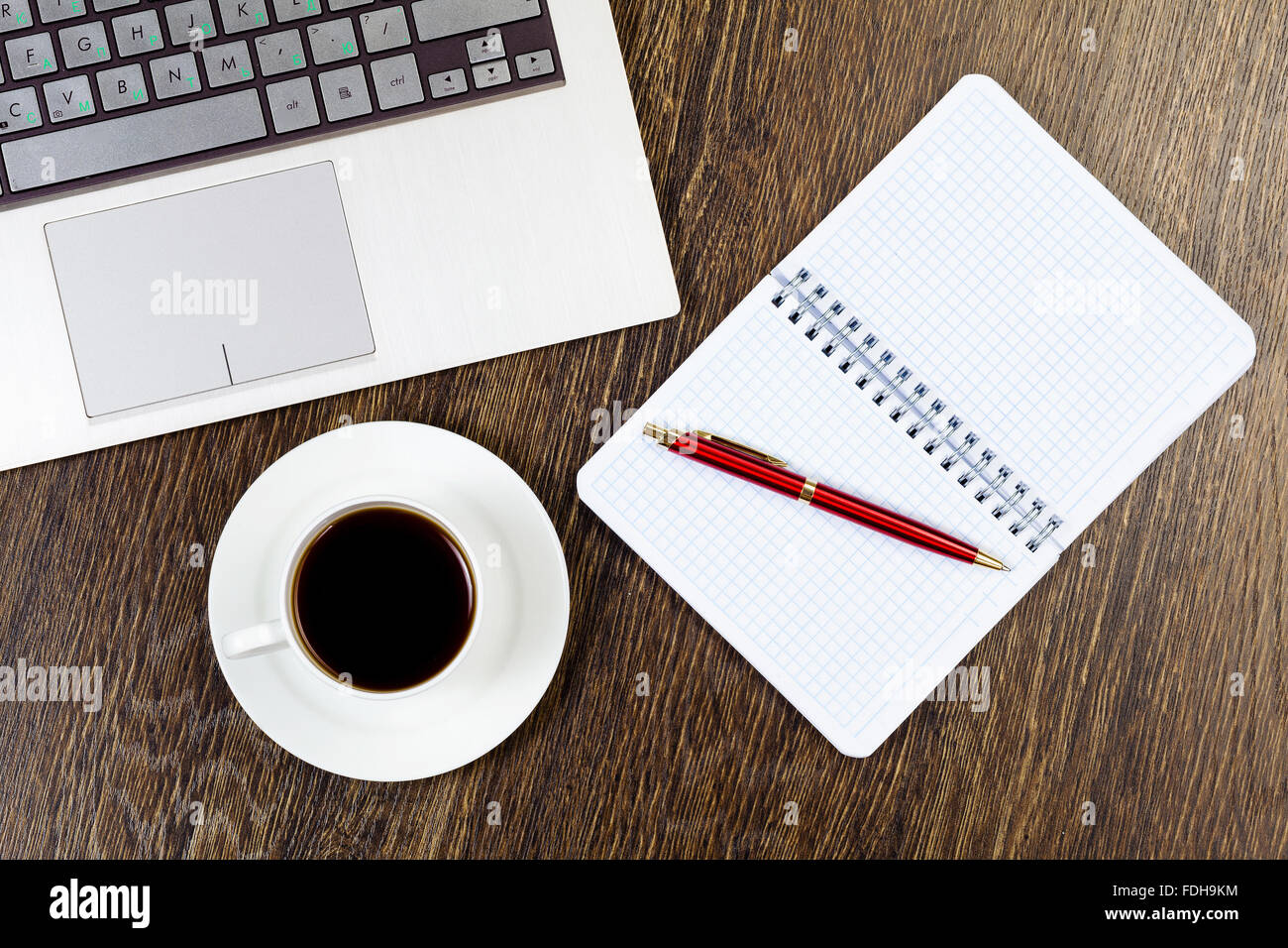 Notebook cup of coffee and notepad at table Stock Photo - Alamy