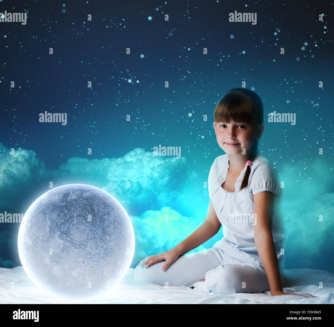 Cute girl sitting in bed with moon Stock Photo - Alamy