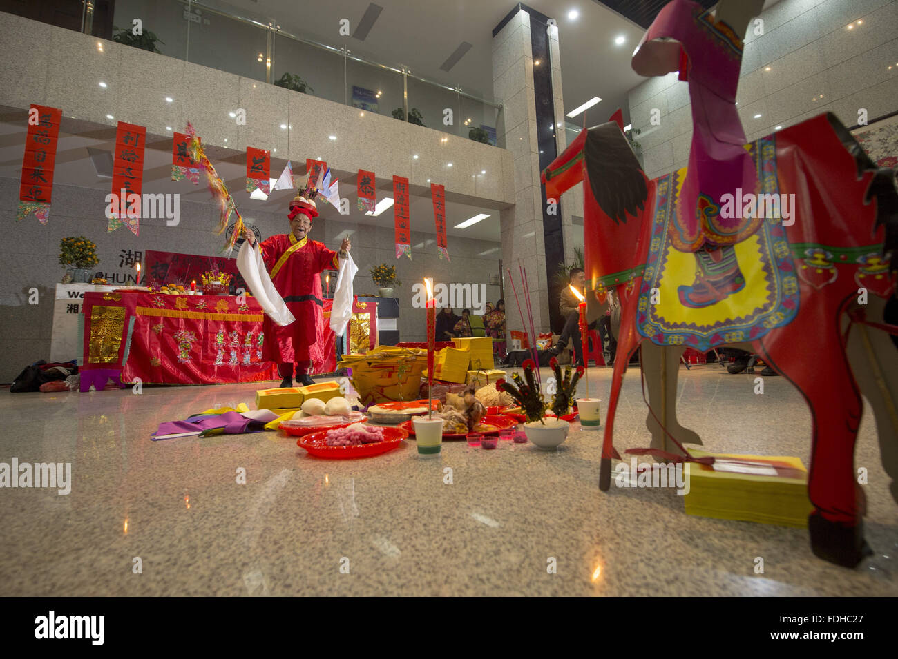 Changsha, Changsha, CHN. 1st Feb, 2016. A wizard presents the ...