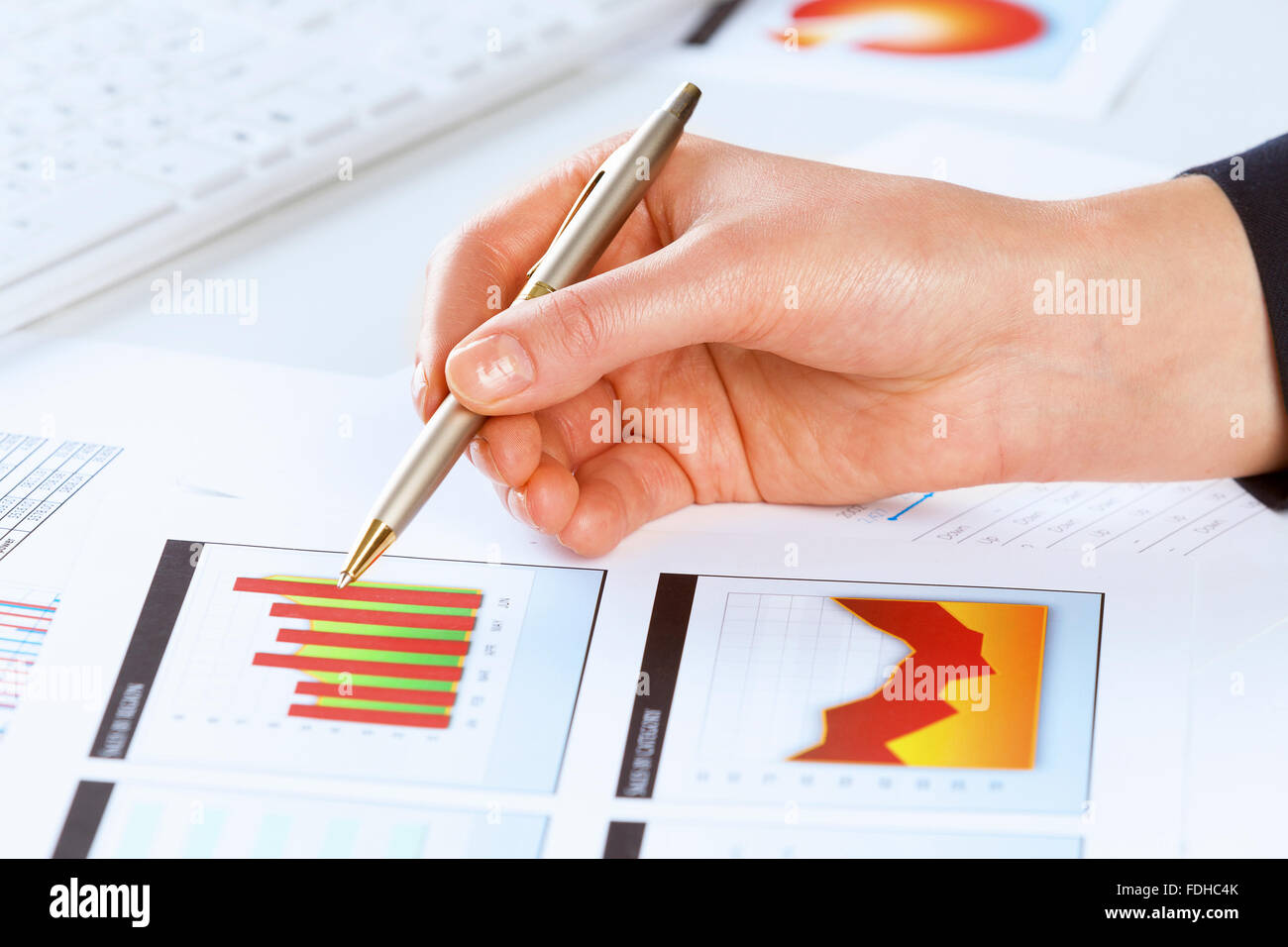 Man businessman pointing to bar graphs hi-res stock photography and ...