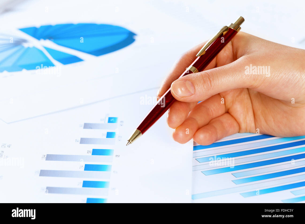 Man businessman pointing to bar graphs hi-res stock photography and ...
