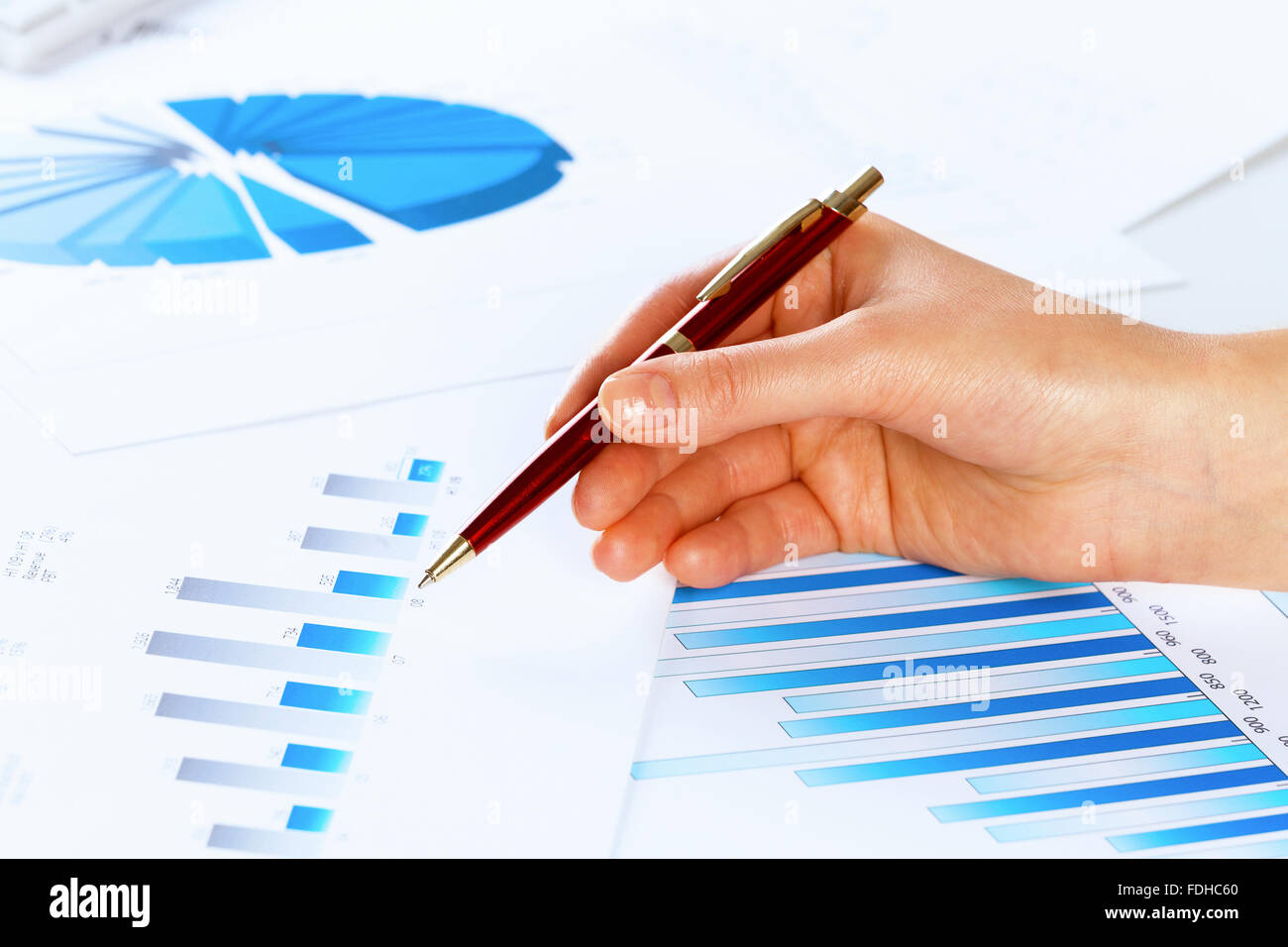 Man businessman pointing to bar graphs hi-res stock photography and ...