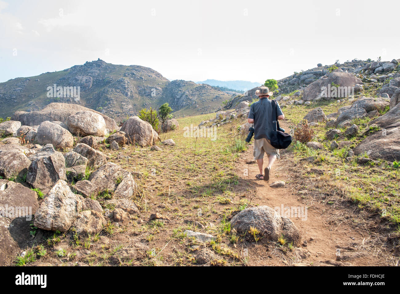 Person walking down path hi-res stock photography and images - Alamy