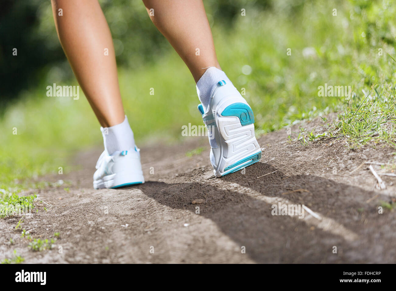 Woman running on countryside road hi-res stock photography and images ...