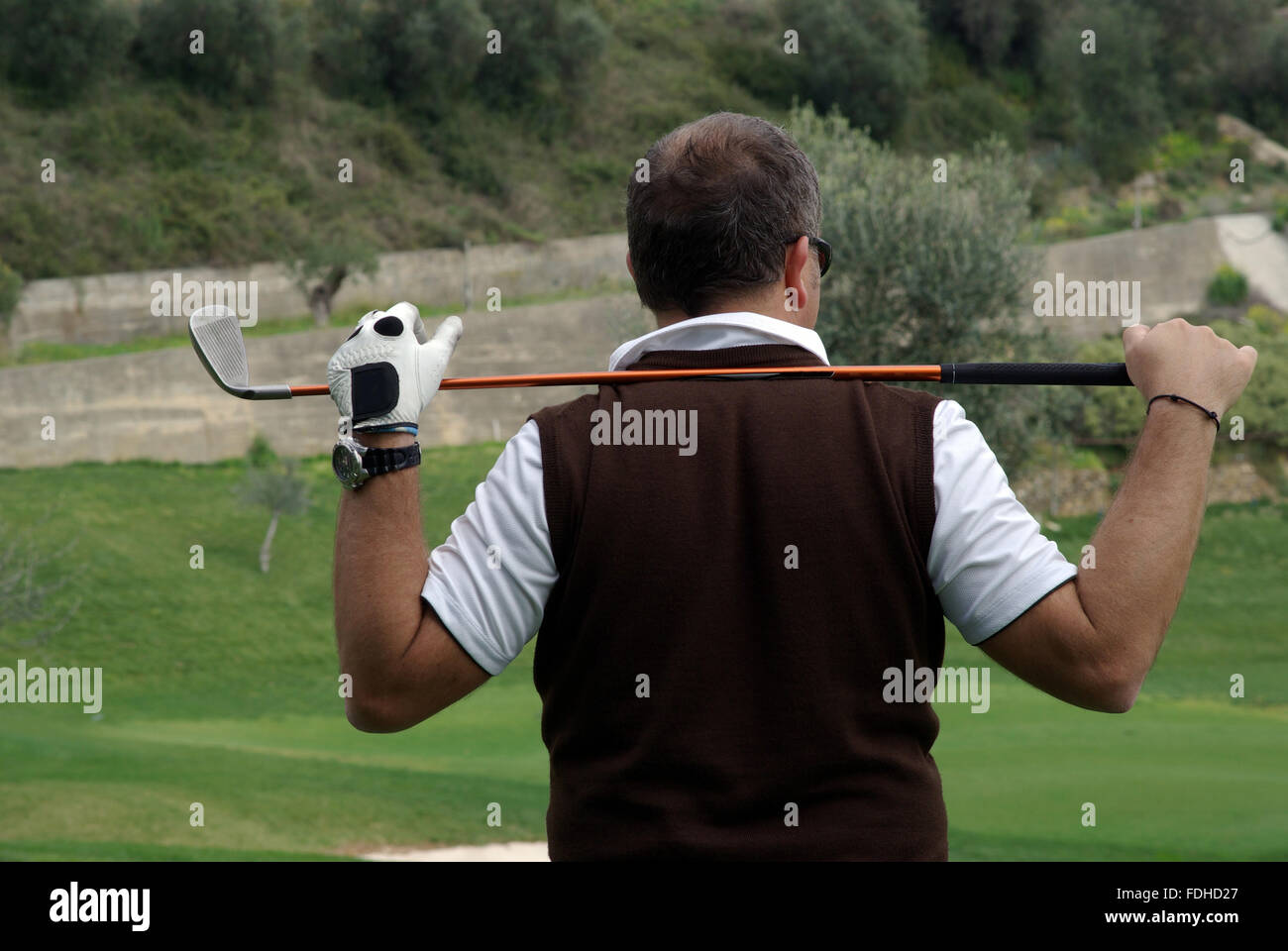 Golf player - man with golf stick Stock Photo - Alamy