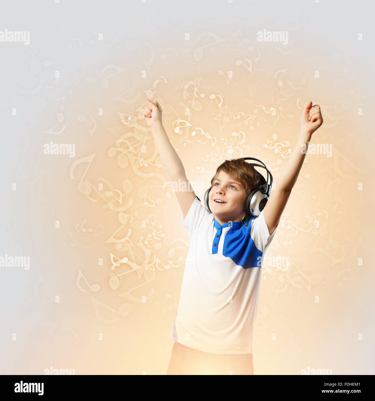 Little cute boy in headphones enjoying music Stock Photo - Alamy