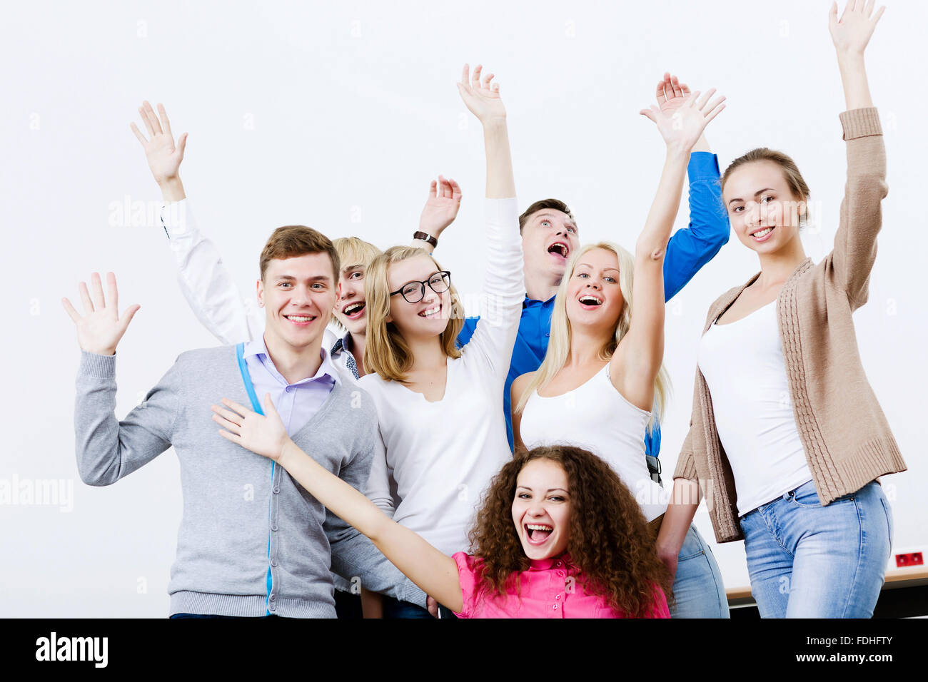 Young happy people in classroom screaming joyfully Stock Photo - Alamy