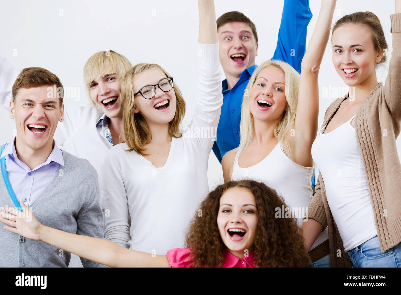 Young happy people in classroom screaming joyfully Stock Photo - Alamy