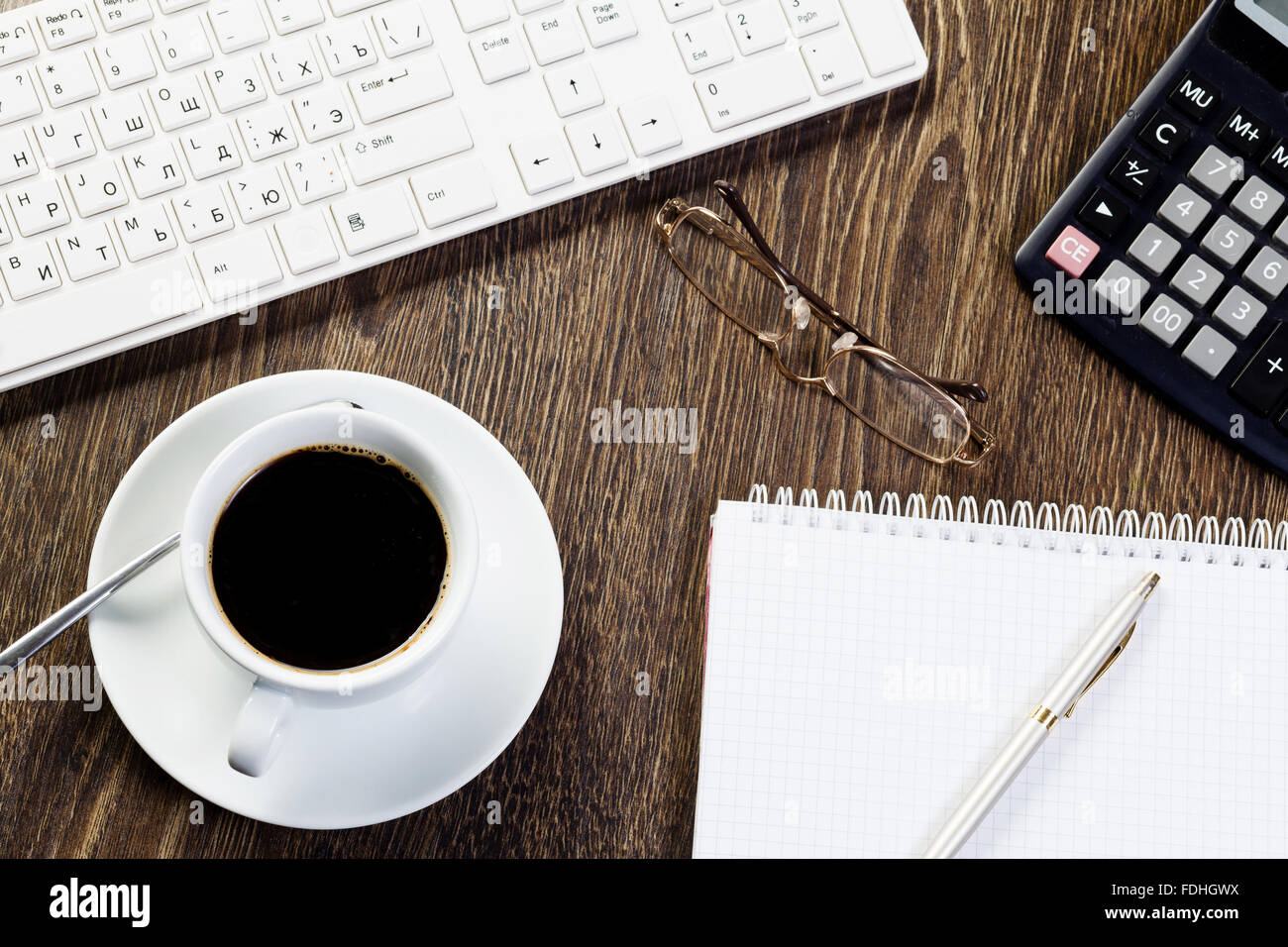 Business work place with cup of coffee calculator and glasses Stock ...