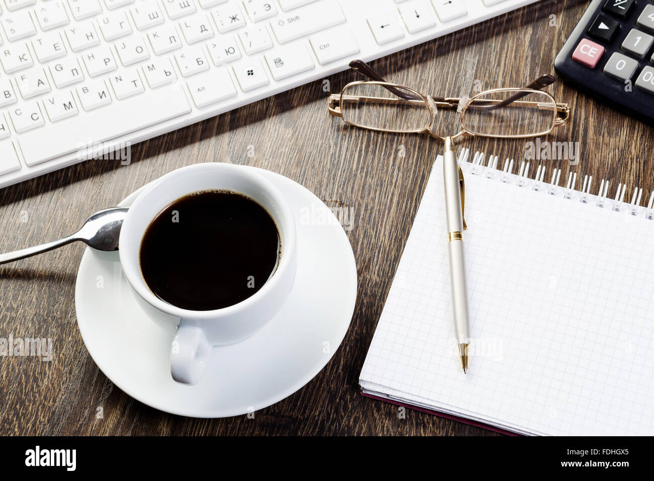Business work place with cup of coffee calculator and glasses Stock ...