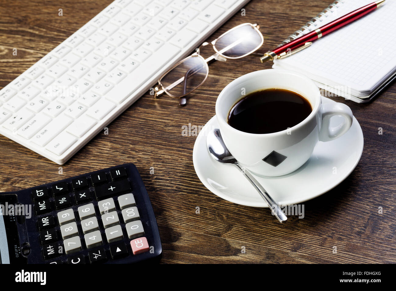 Business work place with cup of coffee calculator and glasses Stock ...