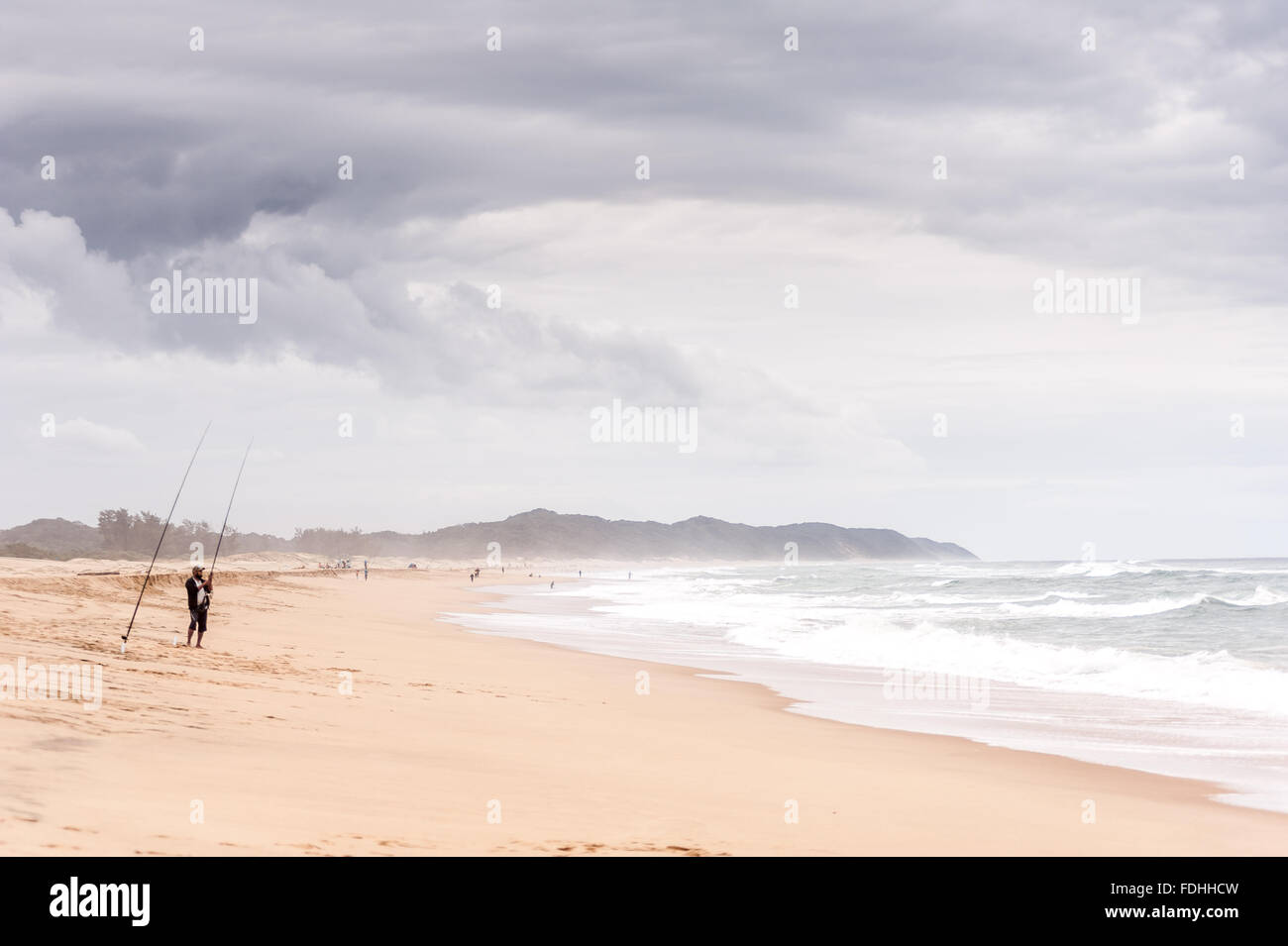 A man fishing in the ocean in Saint Lucia, Kwazulu-Natal, South Africa ...