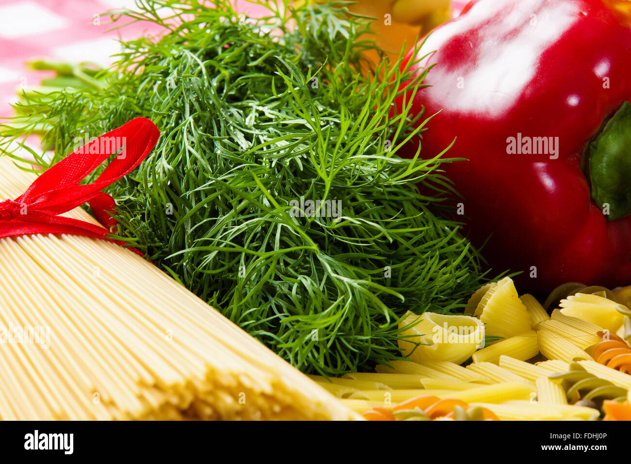 Close up of pepper and other ingredients on kitchen table Stock Photo ...