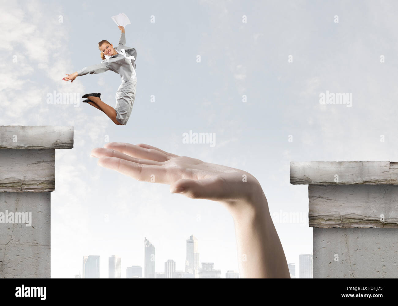 Businesswoman jumping over gap. Risk and challenge concept Stock Photo ...