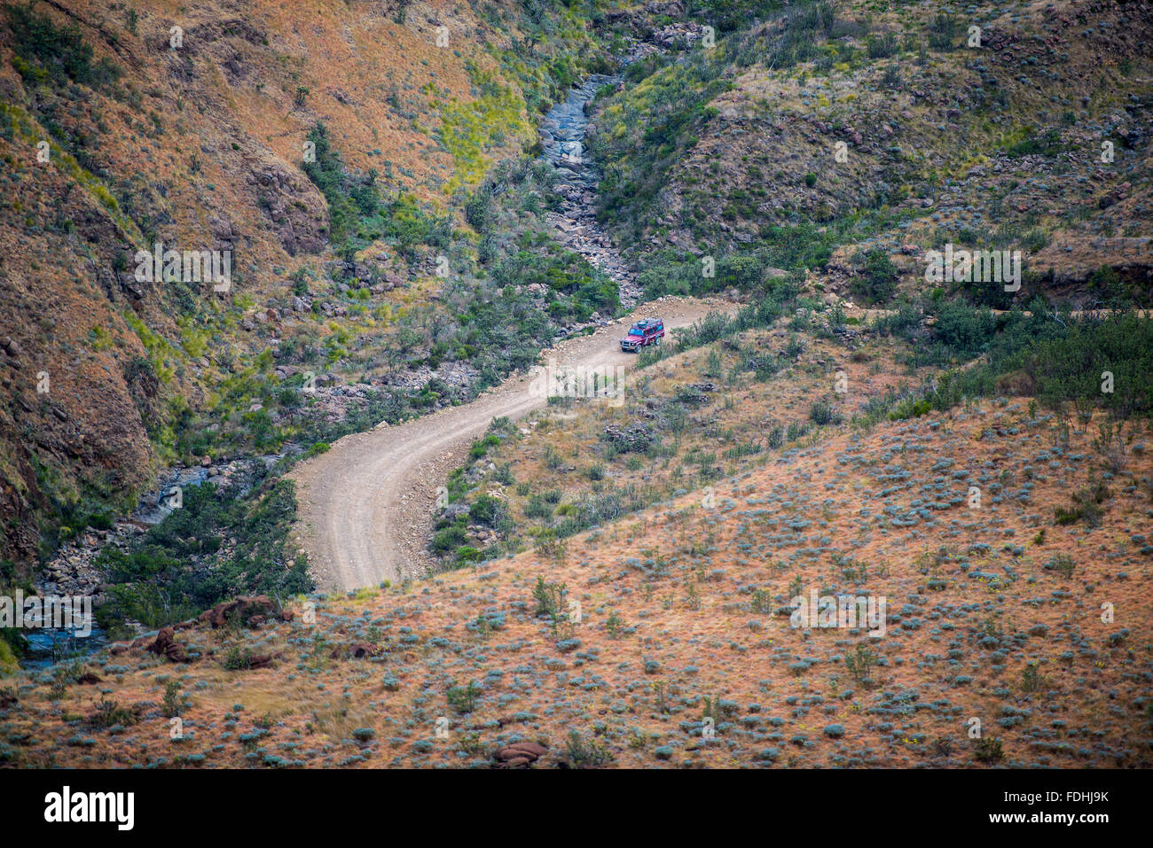 Car driving down winding road hi-res stock photography and images - Alamy