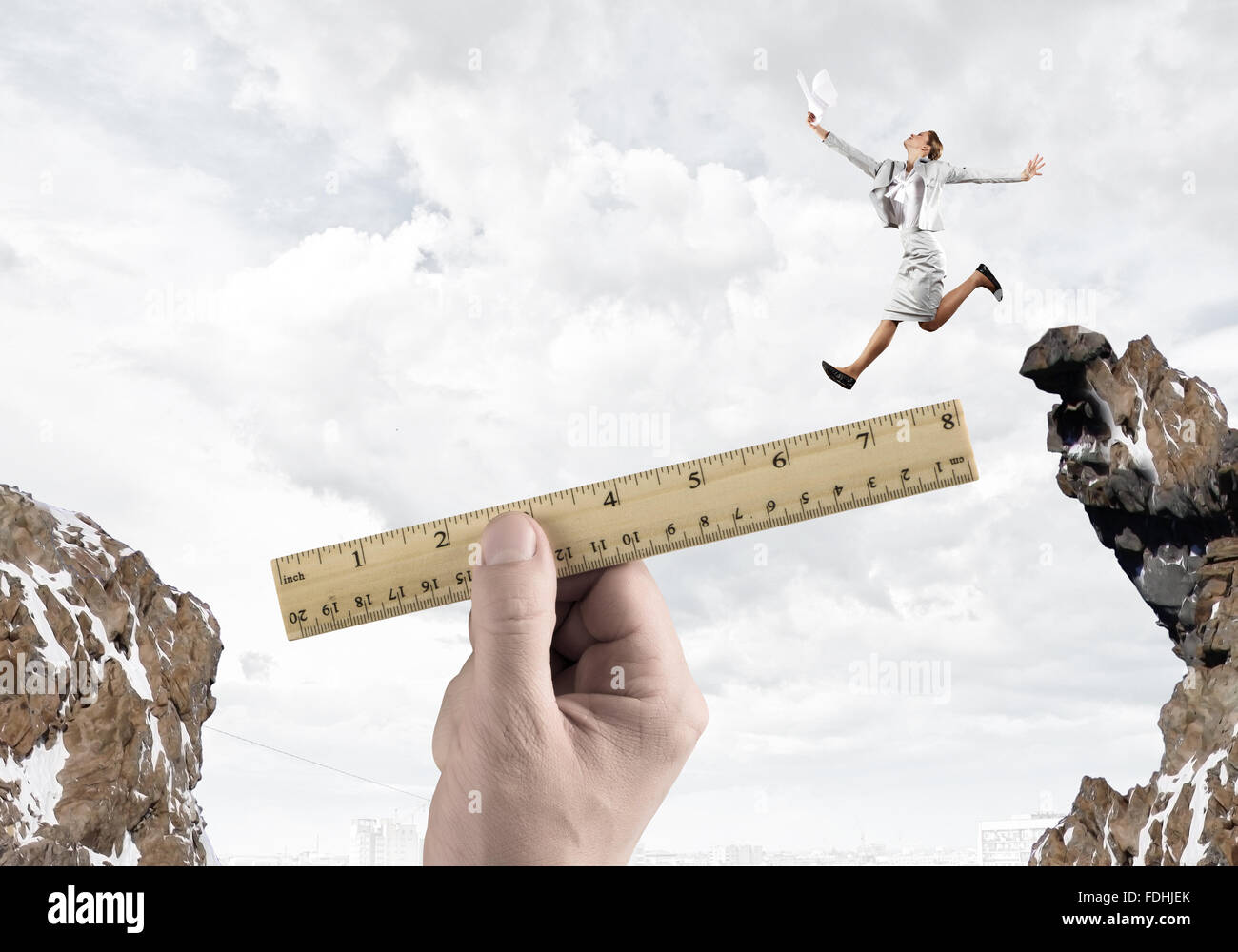 Businesswoman jumping over gap. Risk and challenge concept Stock Photo ...