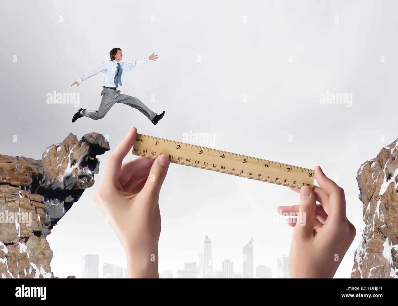 Young successful businessman jumping over gap. Risk and challenge ...