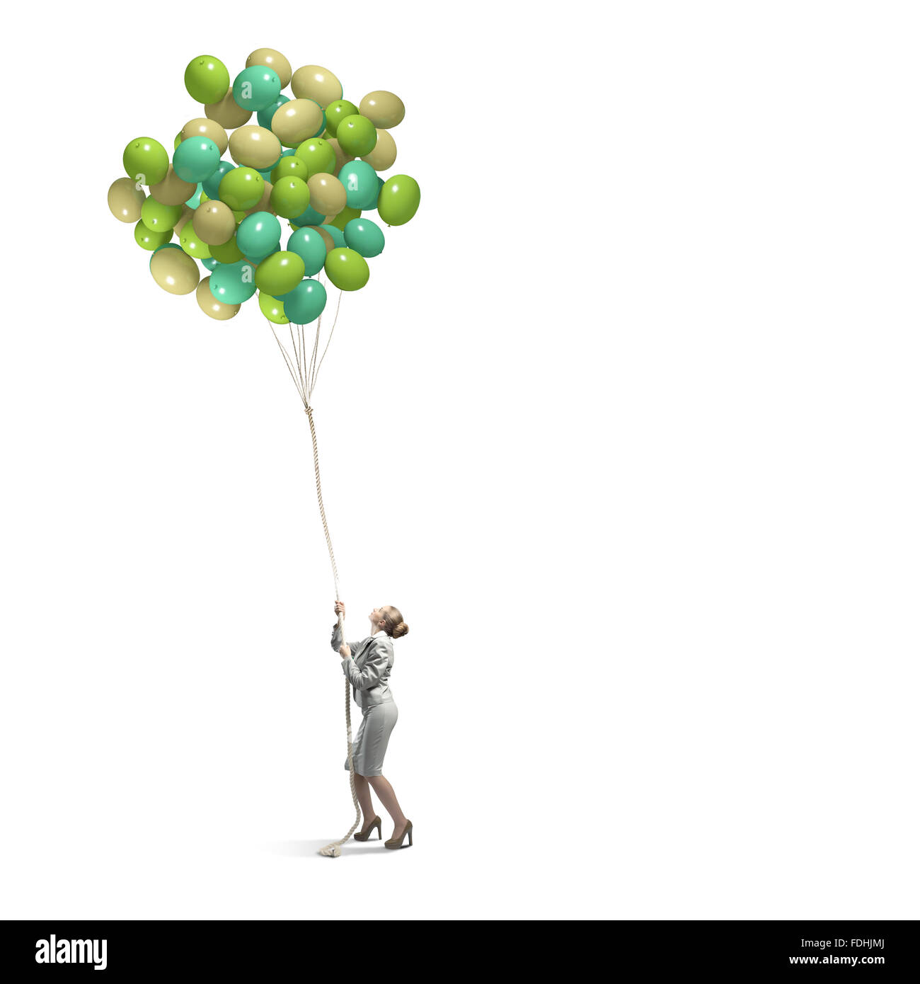 Young businesswoman pulling bunch of colorful balloons Stock Photo - Alamy