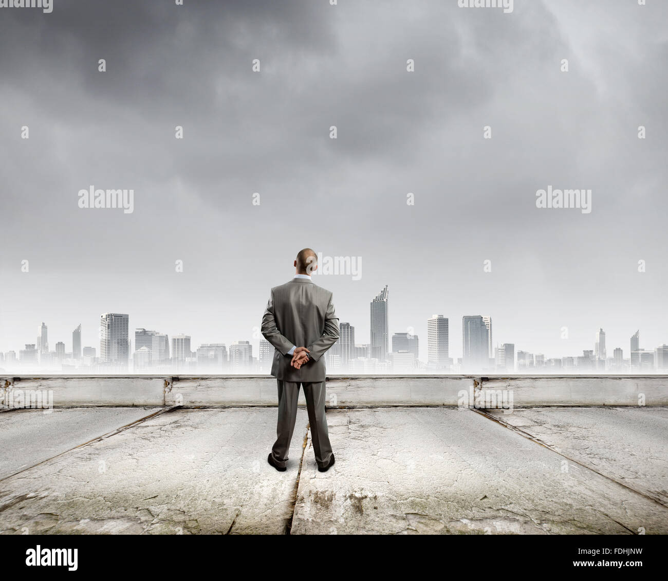 Back view of confident businessman looking at city Stock Photo - Alamy