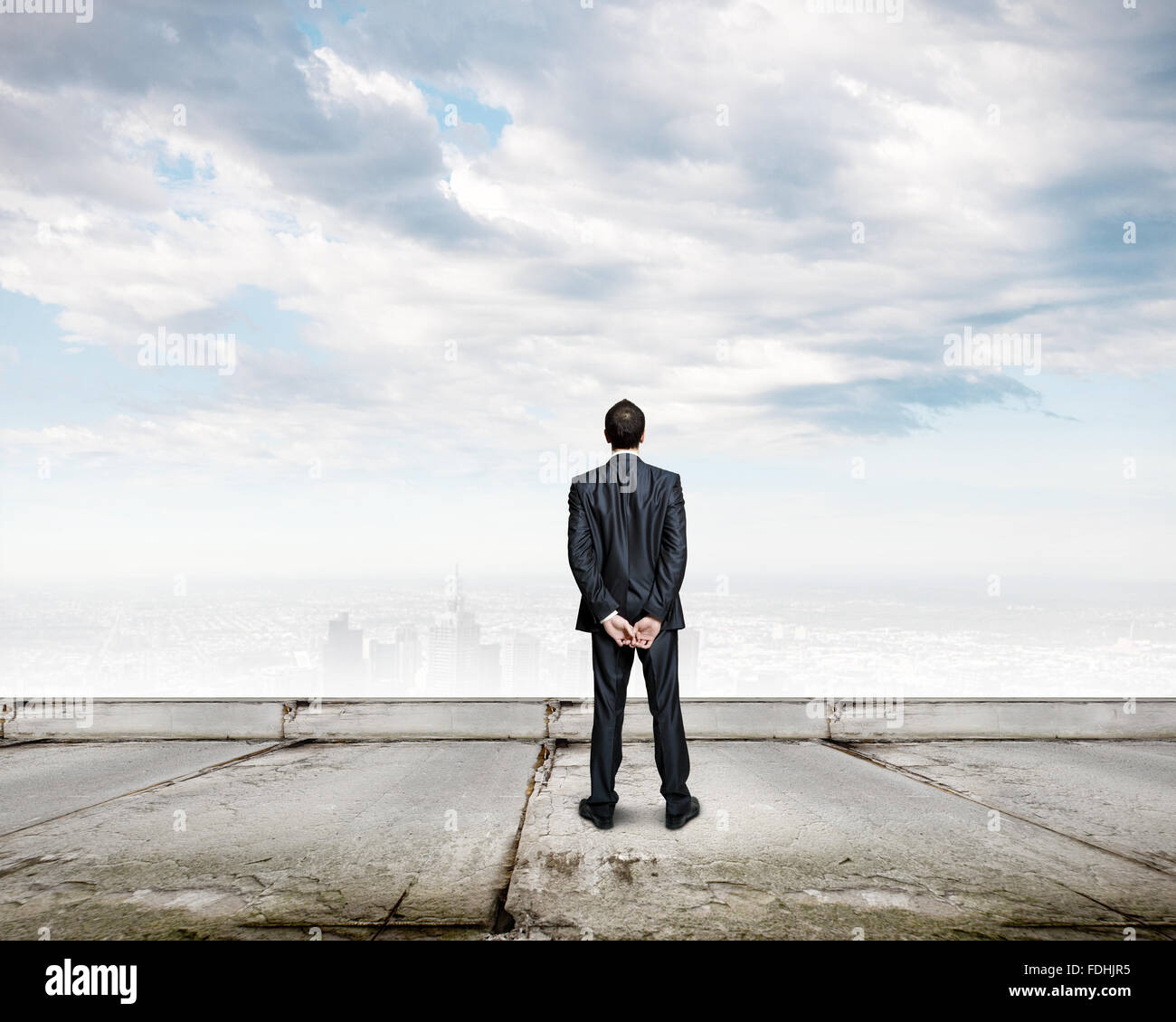 Back view of confident businessman looking at city Stock Photo - Alamy