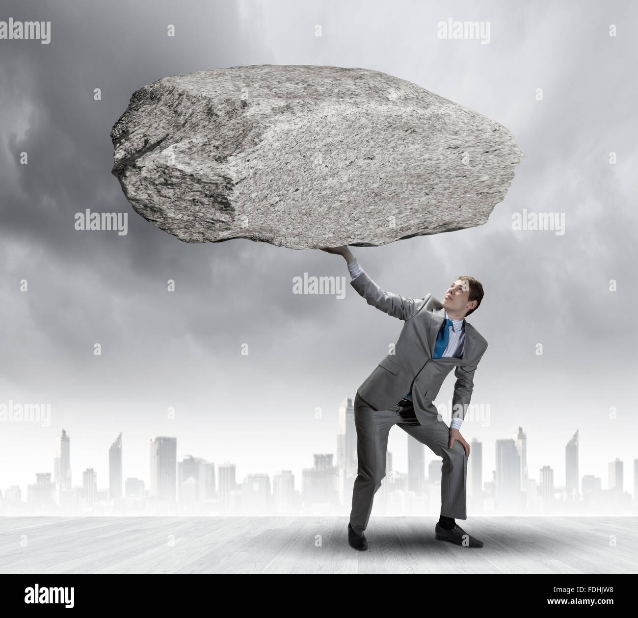 Man holding rock above head hi-res stock photography and images - Alamy