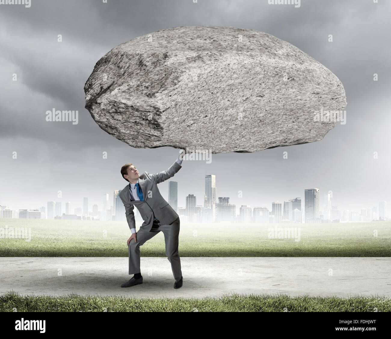 Man holding rock above head hi-res stock photography and images - Alamy