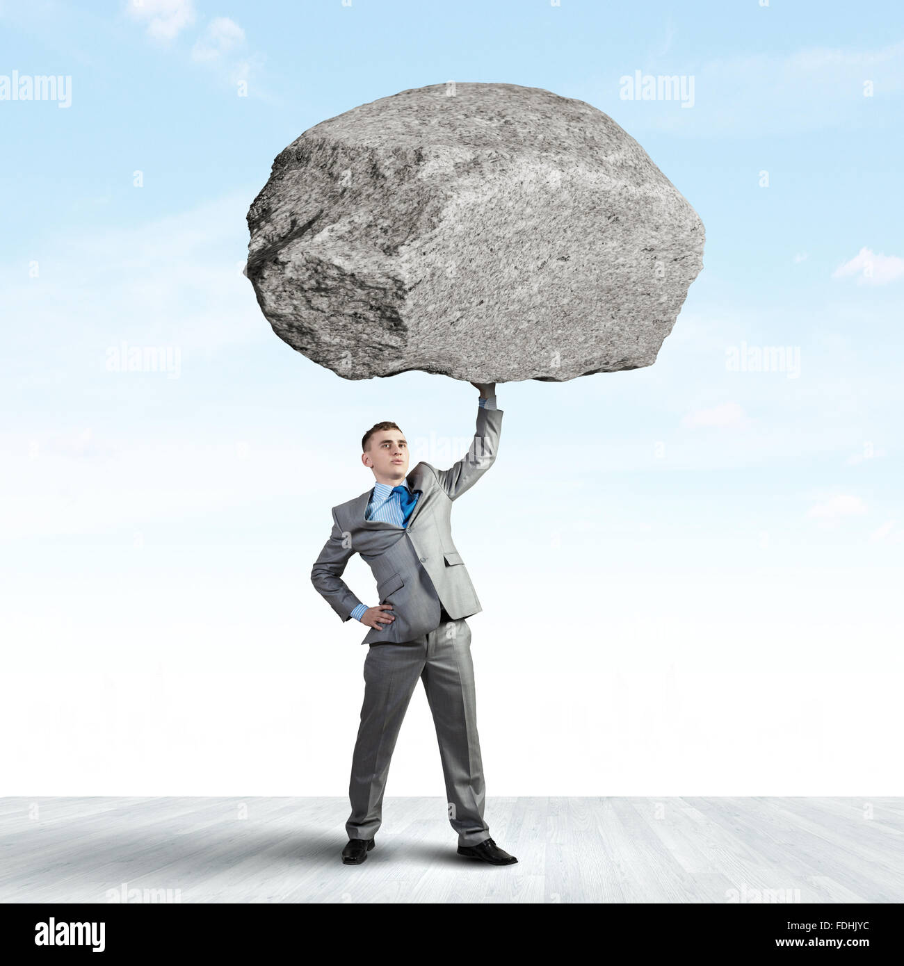 Man holding rock above head hi-res stock photography and images - Alamy