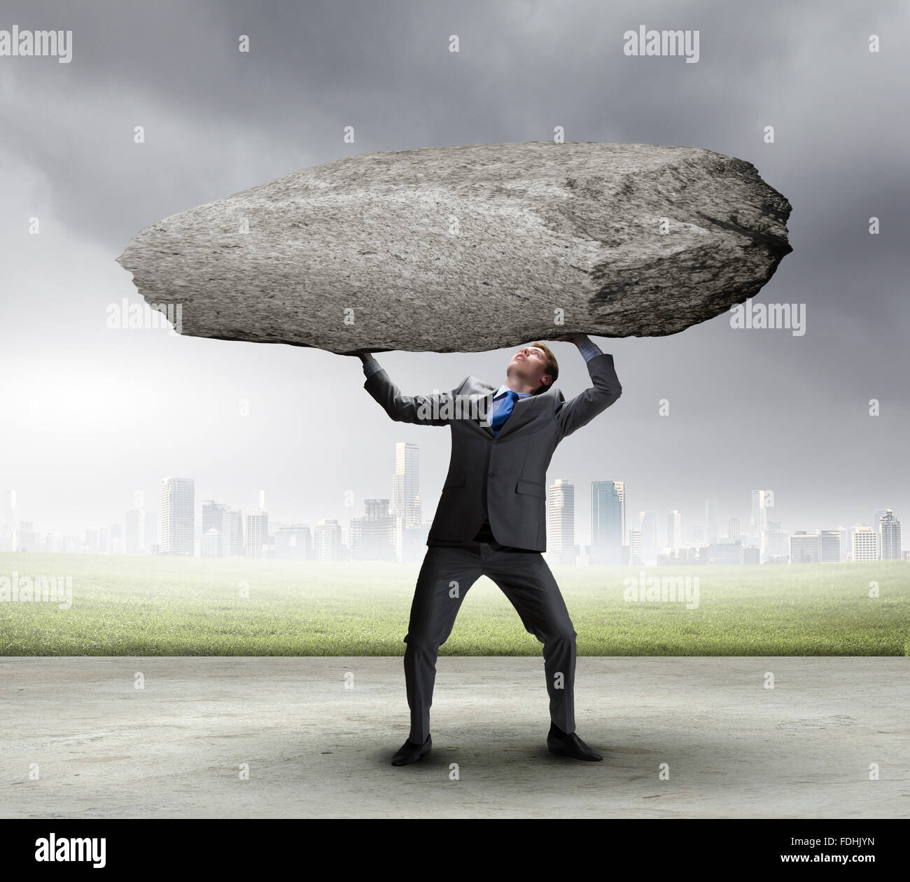Man holding rock above head hi-res stock photography and images - Alamy