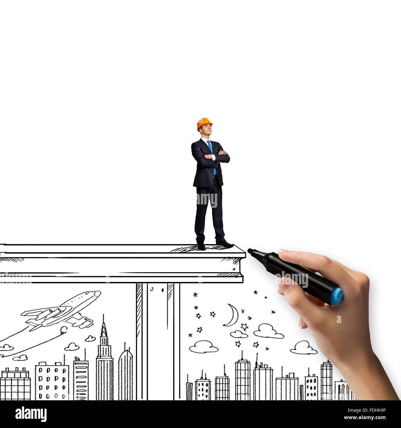 Businessman in helmet standing on construction beam Stock Photo - Alamy