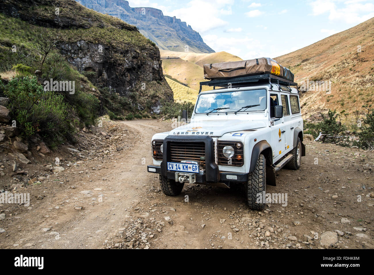 Land Rover Defender parked with mountains in the background in Sani ...