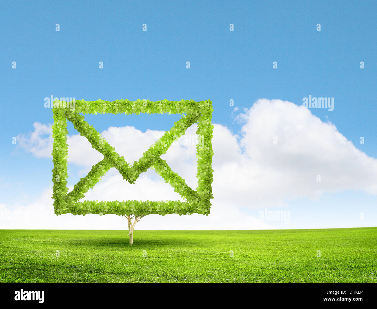 Conceptual image of green plant shaped like email sign Stock Photo - Alamy