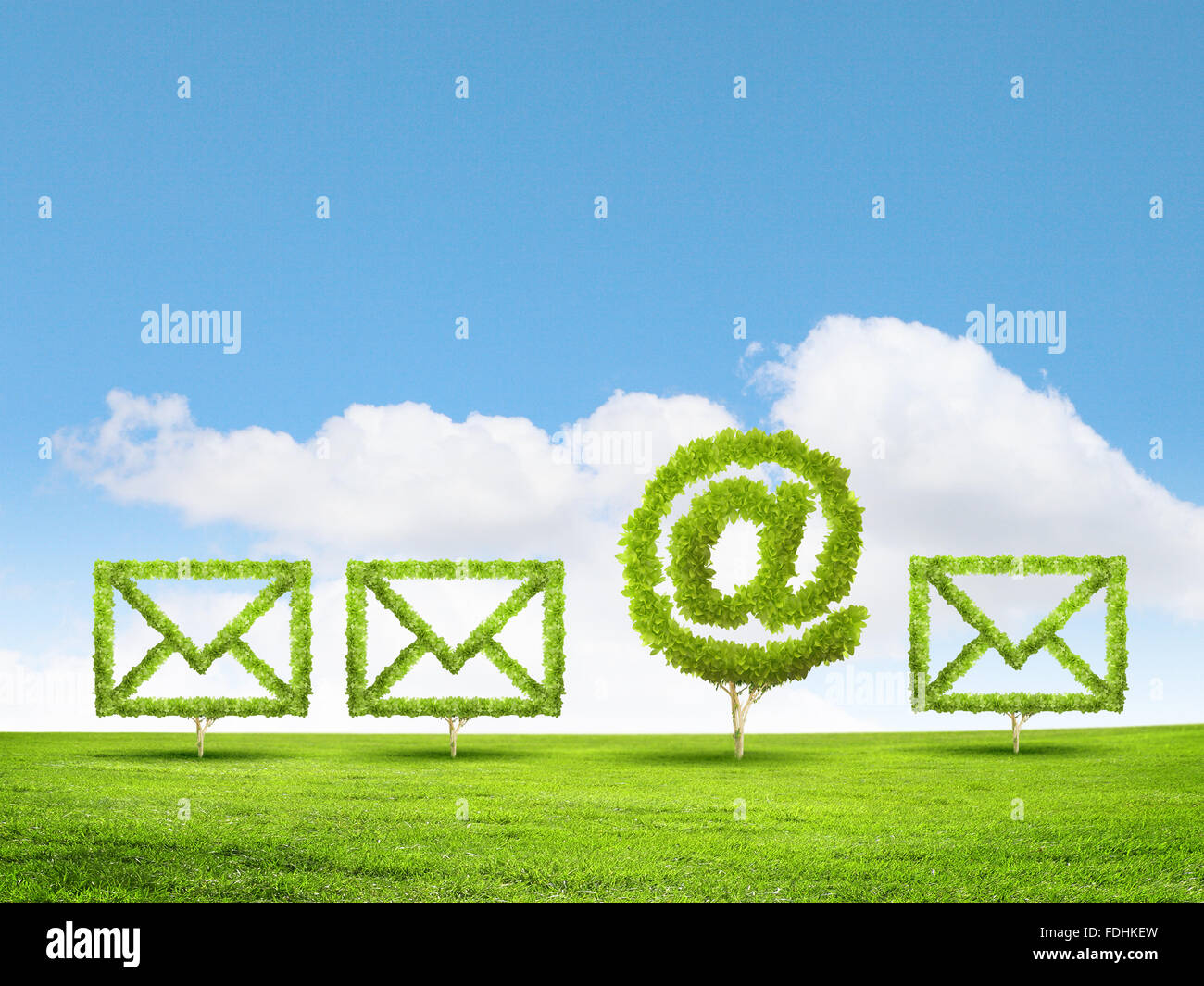 Conceptual image of green plant shaped like email sign Stock Photo - Alamy