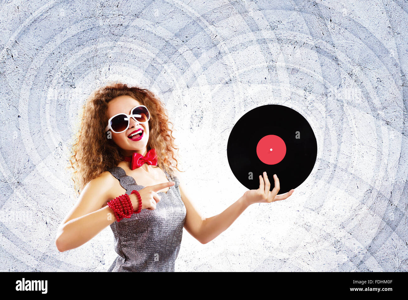 Young pretty girl dj at disco party holding vinyl Stock Photo - Alamy